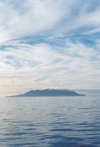 Little Barrier Island capped by orographic cloud. Cirrus clouds ...