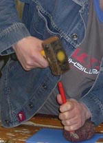 Sean Cooper (DOC) using the chisel-and-hammer method to prepare his ...