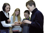 Megan Oliver (left), Nathaniel Manning (right), his sister, and a ...