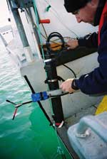 Craig deploys an instrument to measure turbulence. (Photo: Dave Plew ...